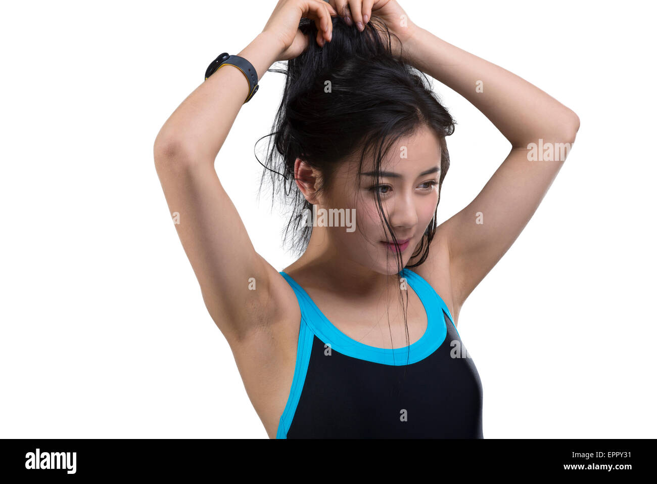 Female swimmer running fingers through hair Stock Photo - Alamy