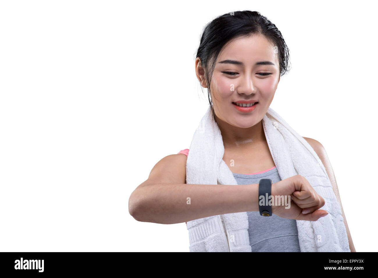 Young female athlete checking smartwatch Stock Photo - Alamy
