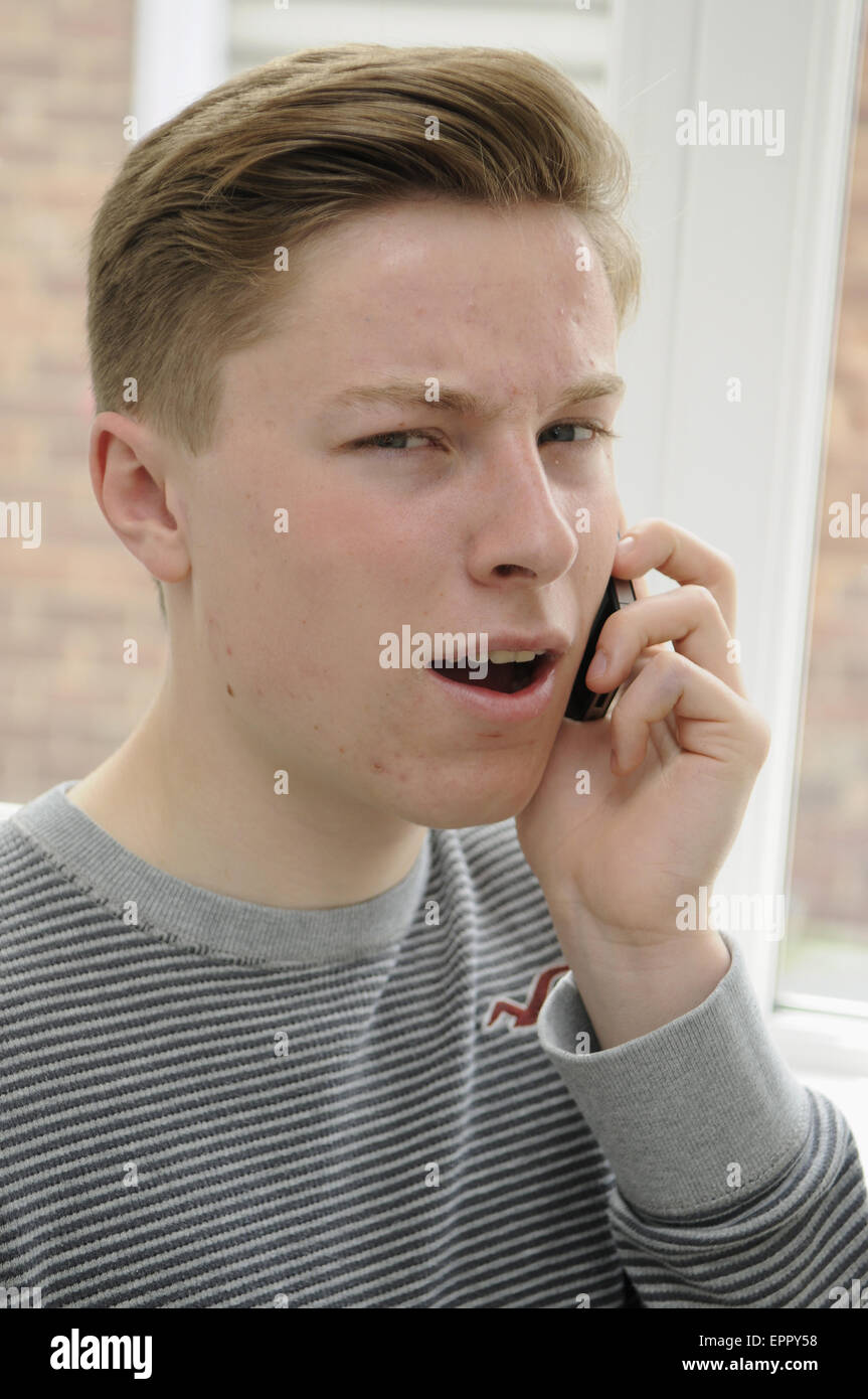 Teenage talking on his mobile phone Stock Photo - Alamy