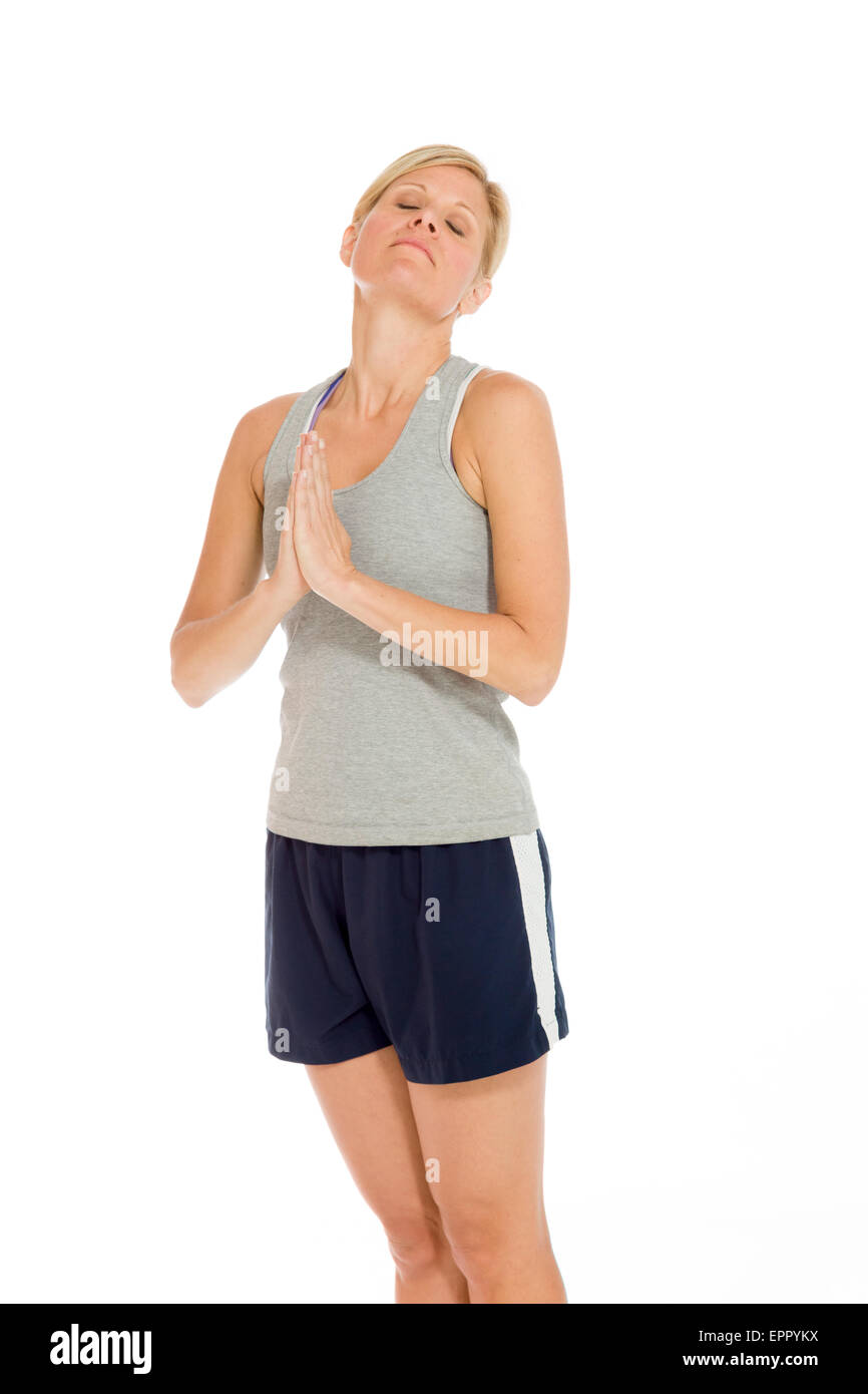 Model isolated on plain background in studio wishing praying Stock ...