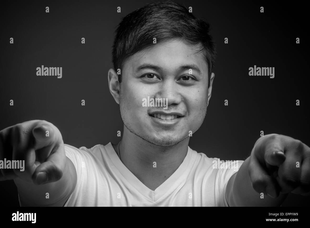 Model pointing to camera Stock Photo - Alamy