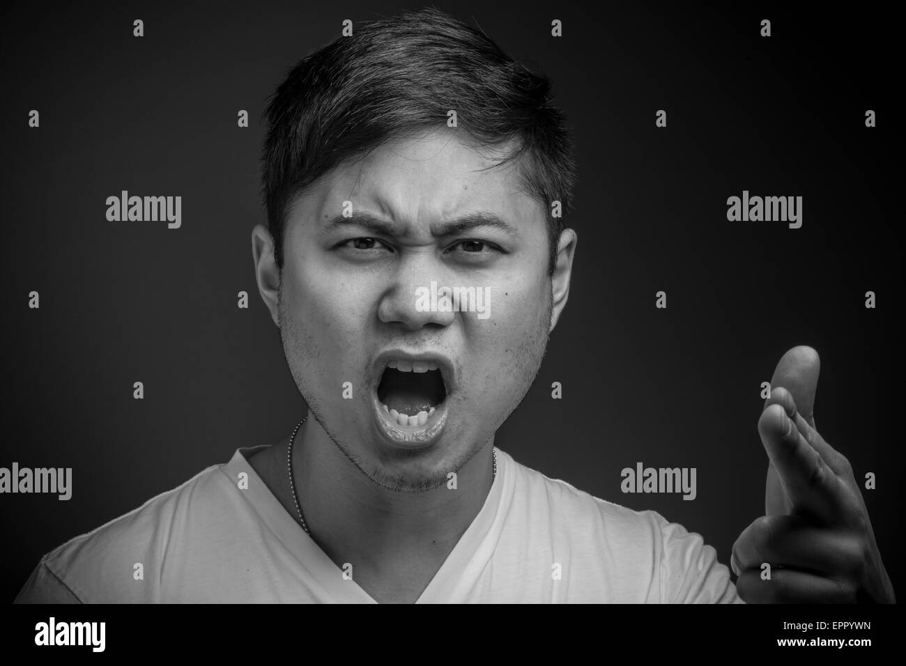 Model angry scolding and pointing Stock Photo - Alamy