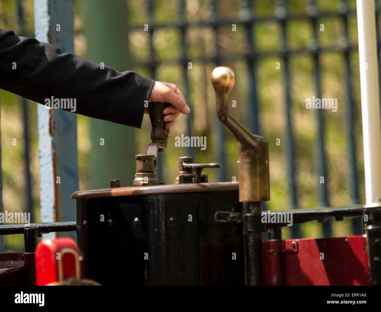 a drivers hand on the controls of a vintage tram at the National ...