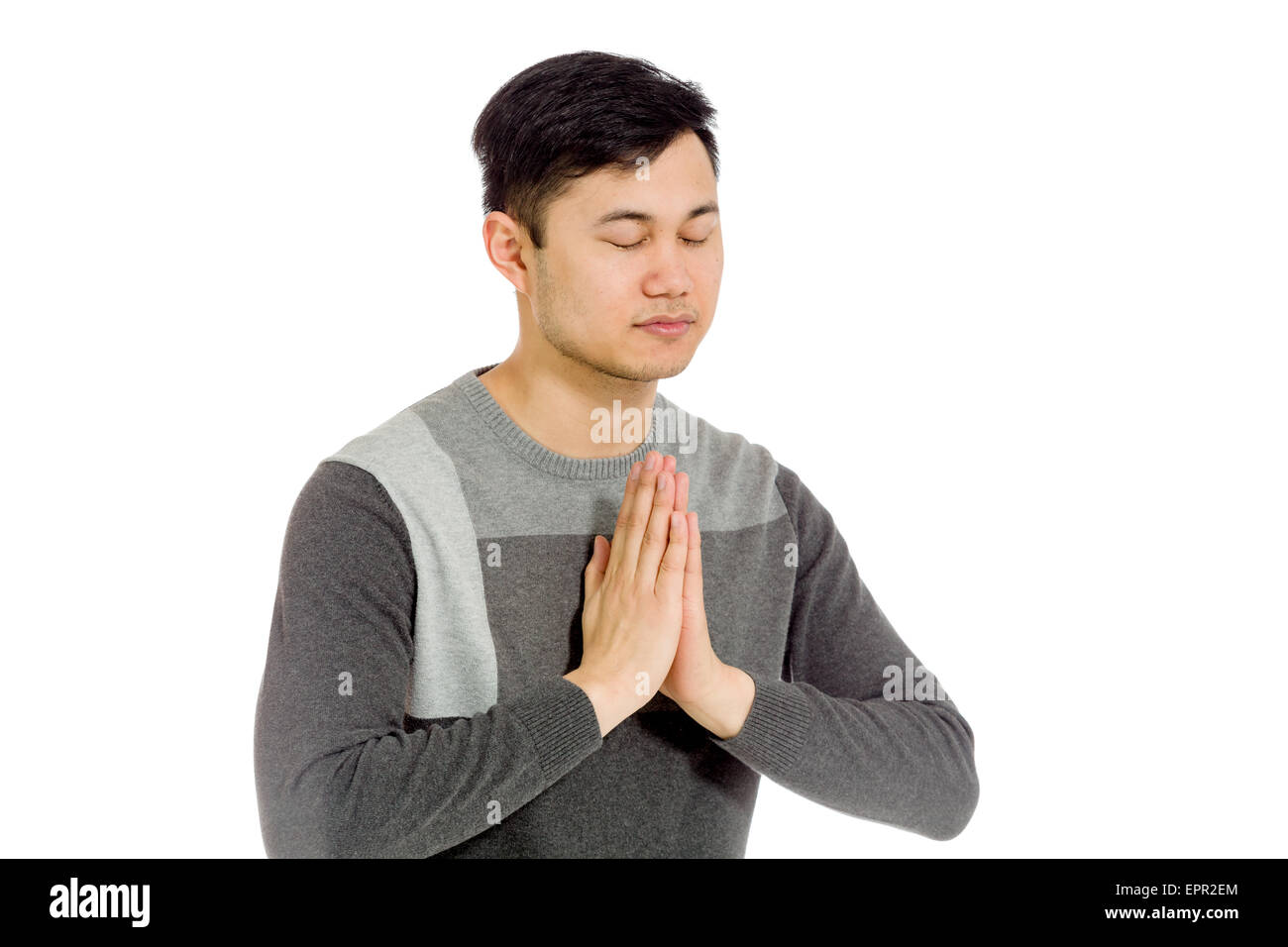 Model isolated on plain background in studio wishing praying Stock ...