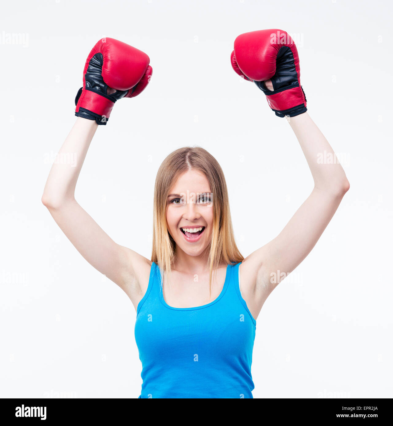 Cheerful woman in boxing gloves celebrating victory isolated on a whtie ...