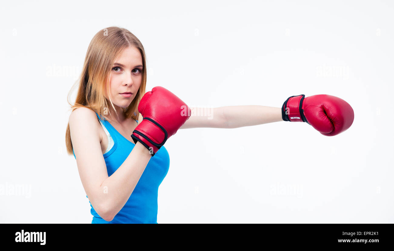 Side view portrait of a young woman in boxing gloves isolated on a ...