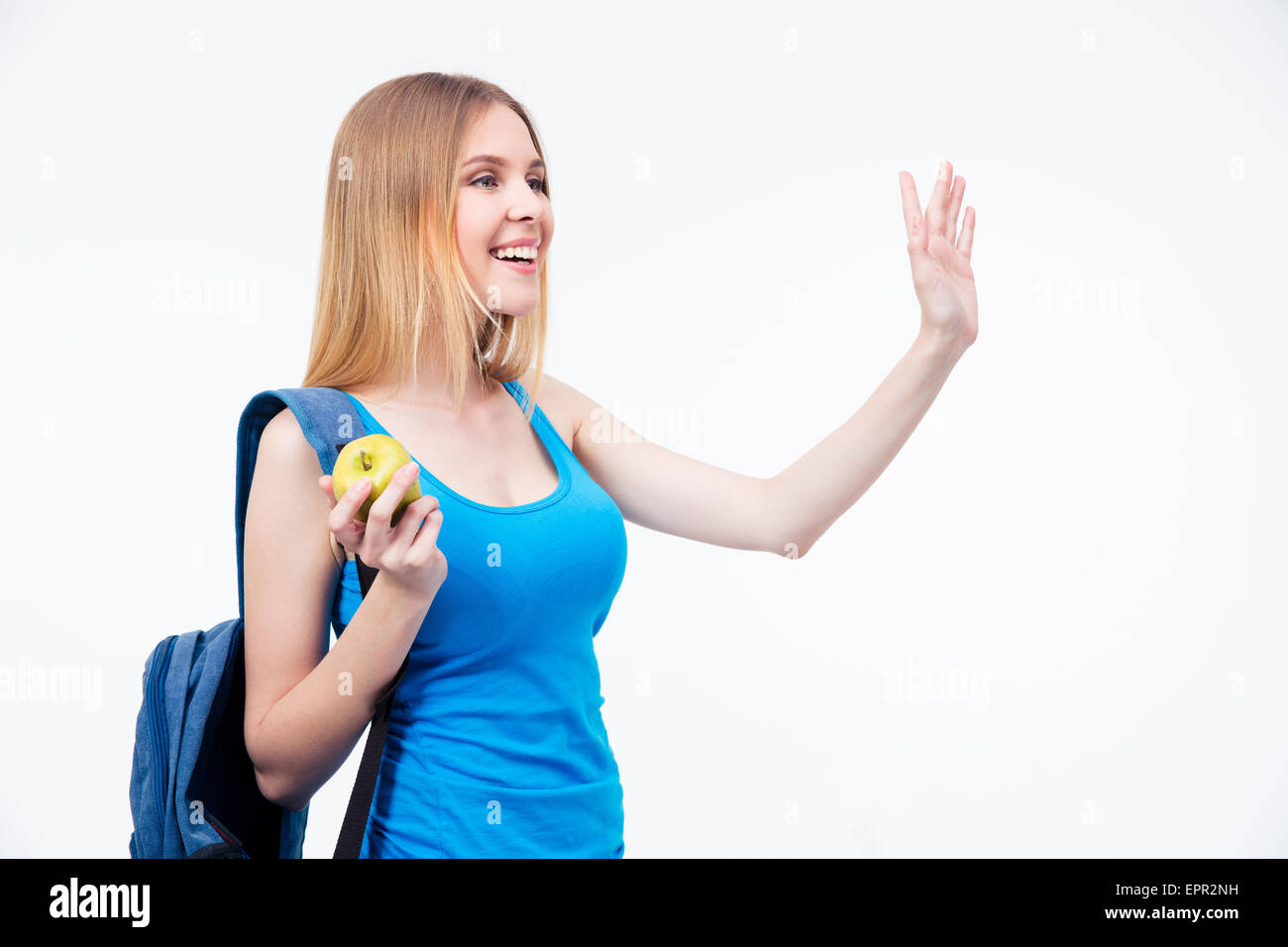 Young woman making salutation sign isolated on a white background ...