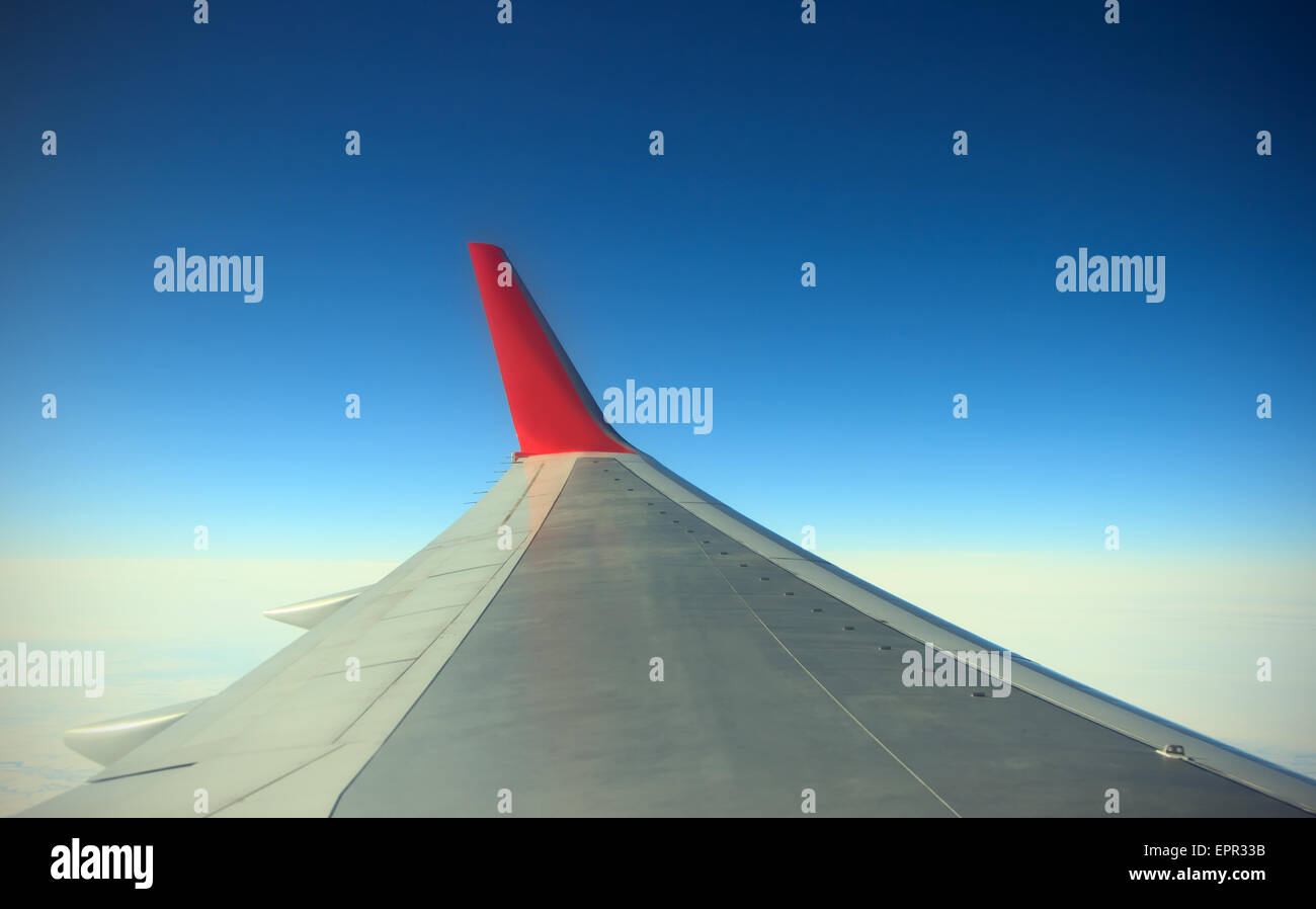 Wing of airplane from window Stock Photo - Alamy