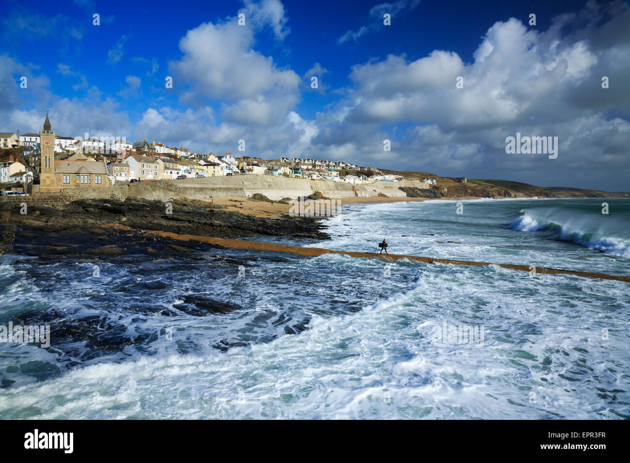 Bodyboarder heading out to the waves on Porthleven Beach, near Helston ...