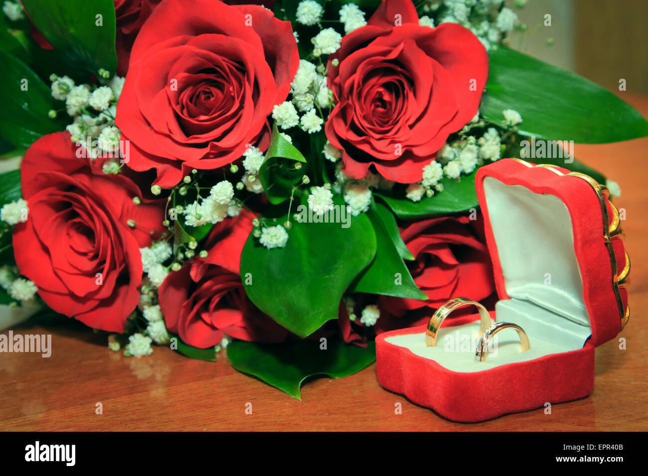 Wedding Ring and Red Rose Stock Photo - Alamy