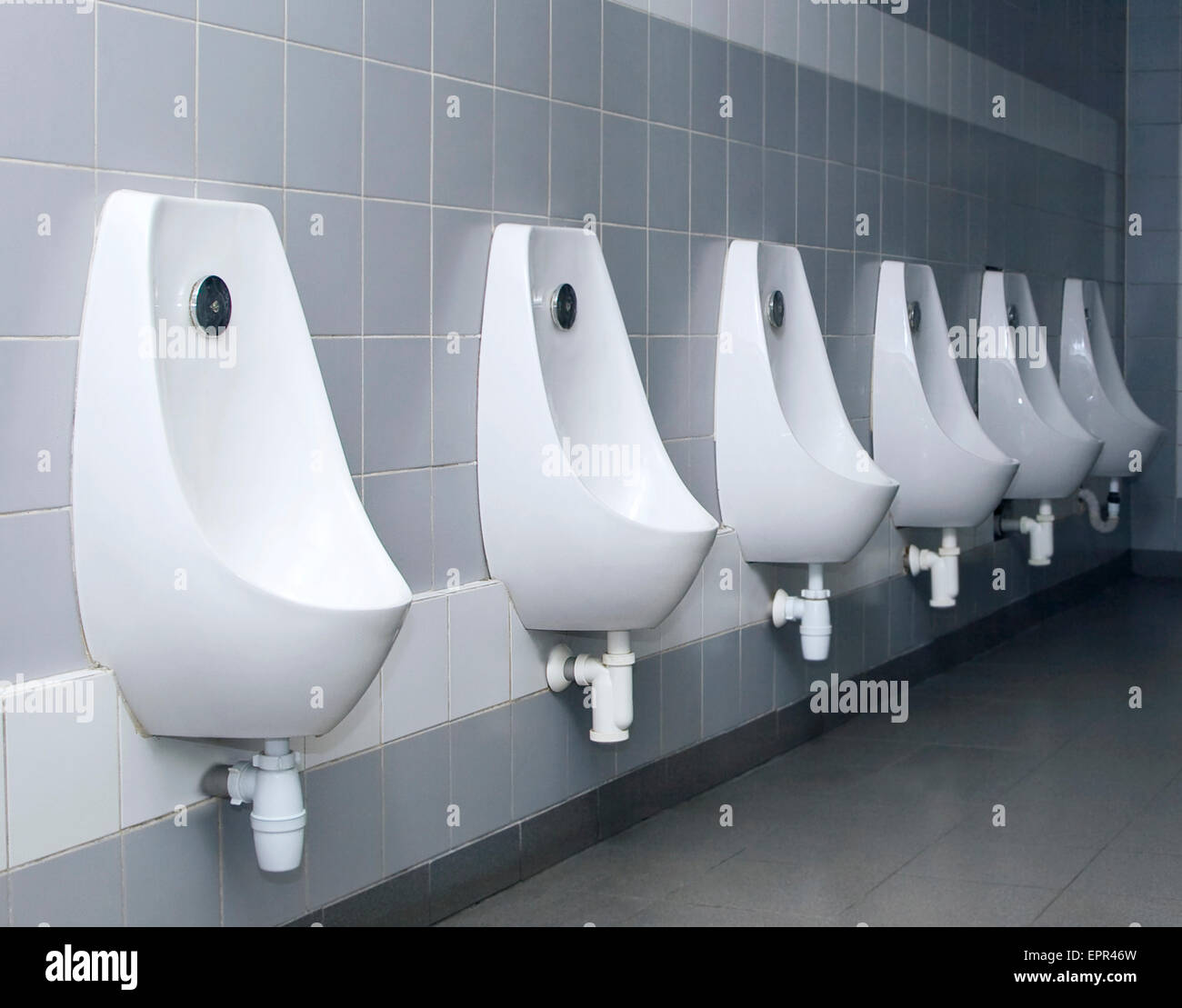 modern restroom interior with urinal row Stock Photo - Alamy
