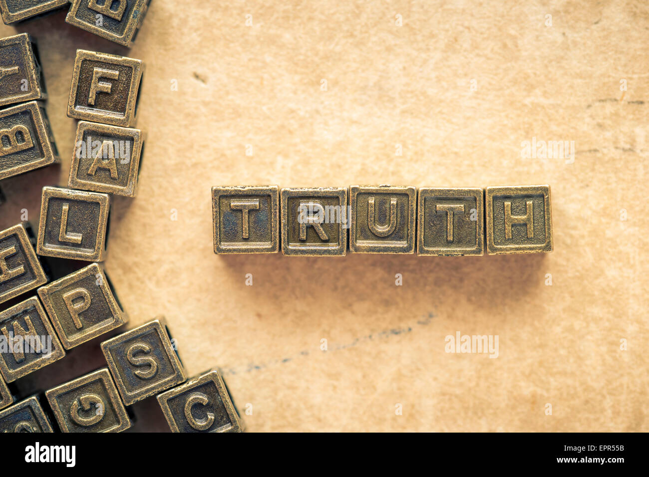 truth word made from metallic blocks over grunge paper background Stock ...