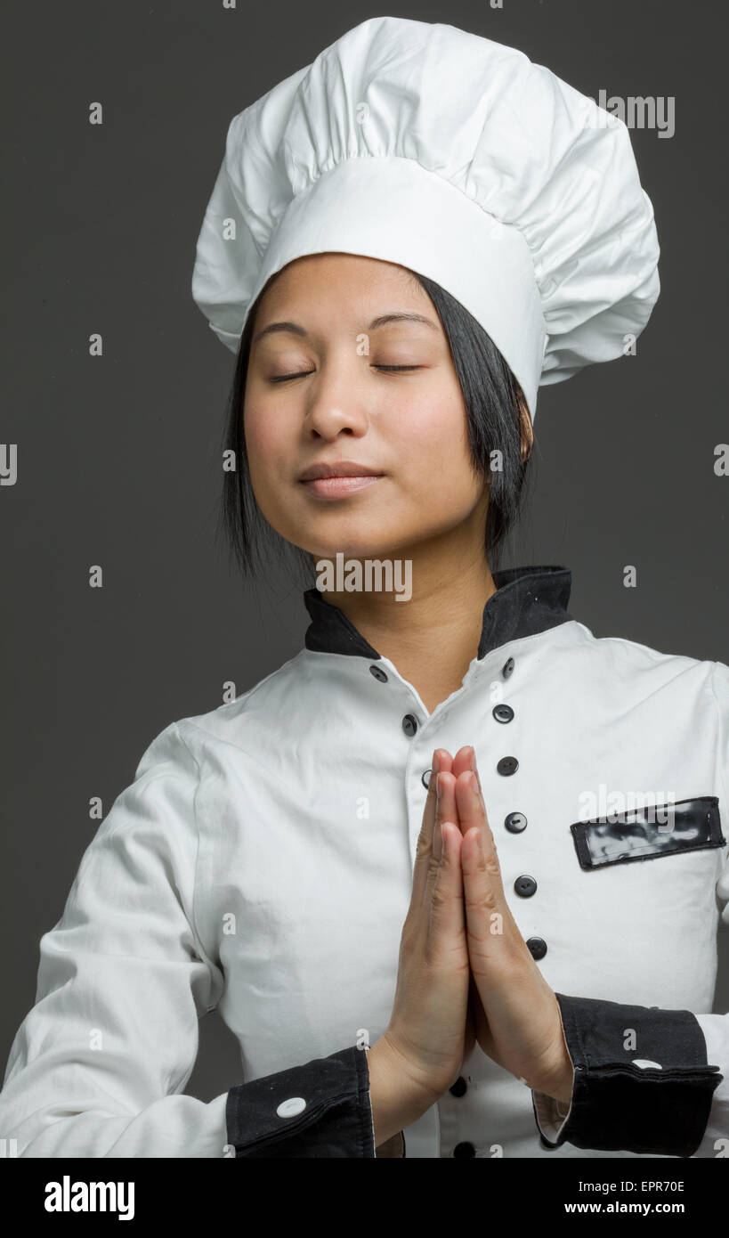 Model isolated on plain background in studio wishing praying Stock ...