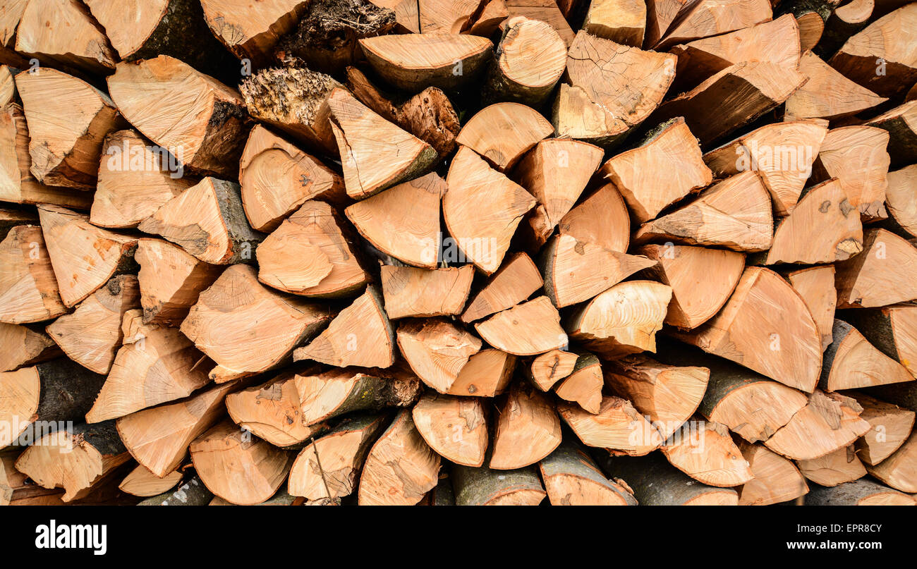 Stacked wooden logs background Stock Photo - Alamy