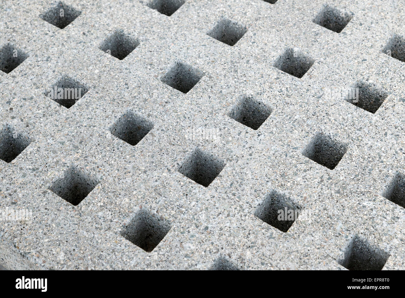 granite surface perforated with square holes Stock Photo - Alamy