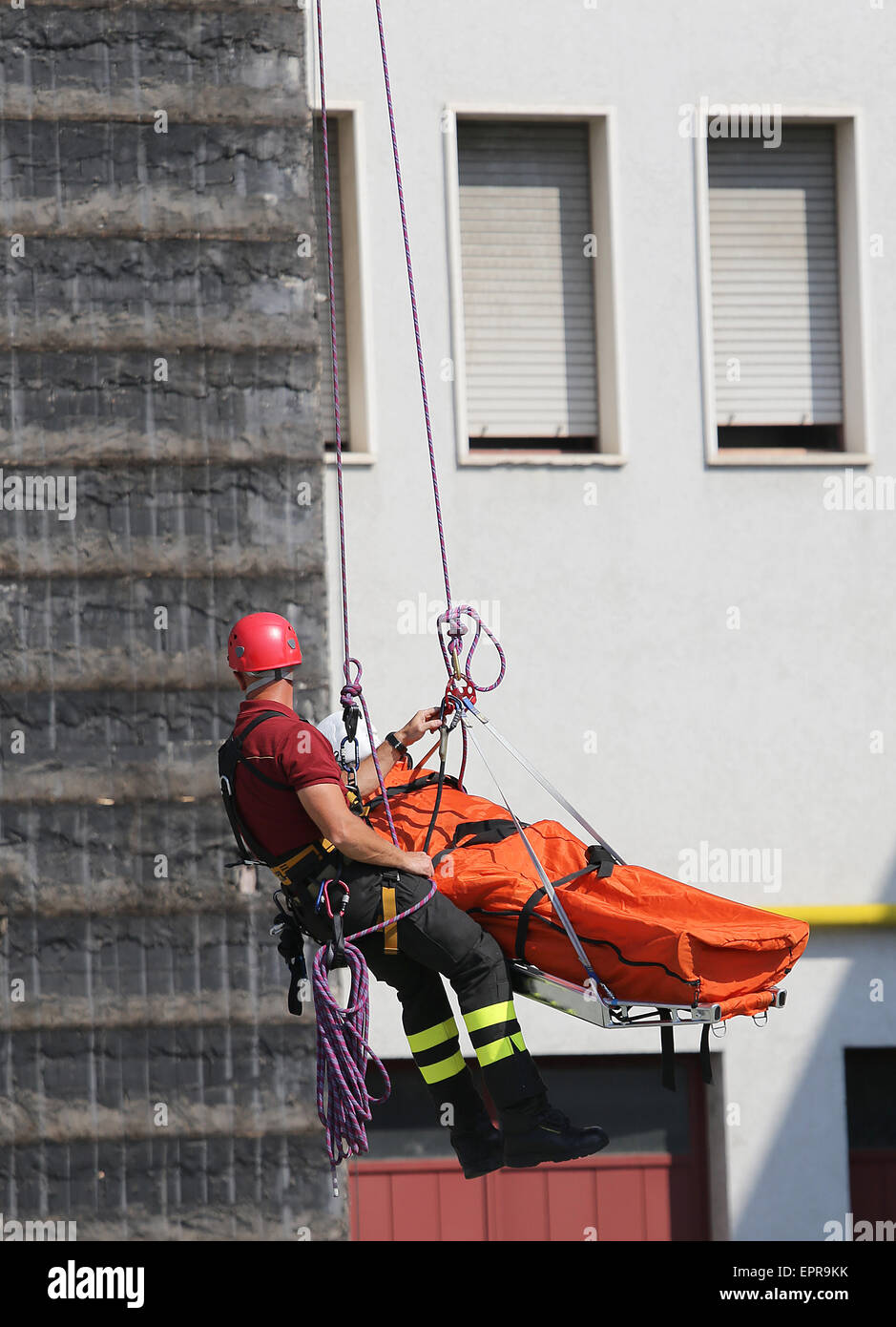 Fireman carries the stretcher with the dummy Stock Photo - Alamy