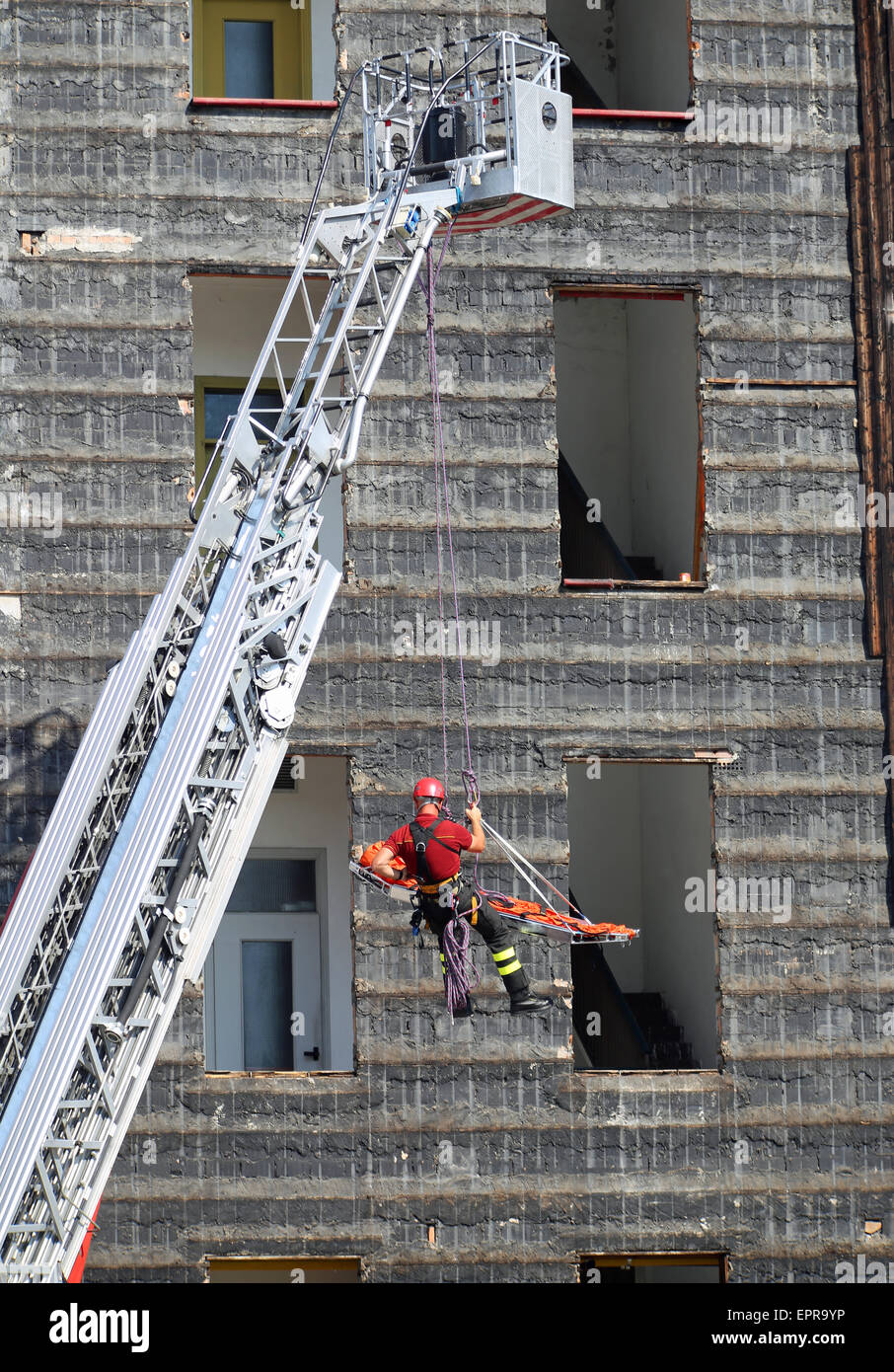 fearless fireman during an exercise carries the stretcher with the ...