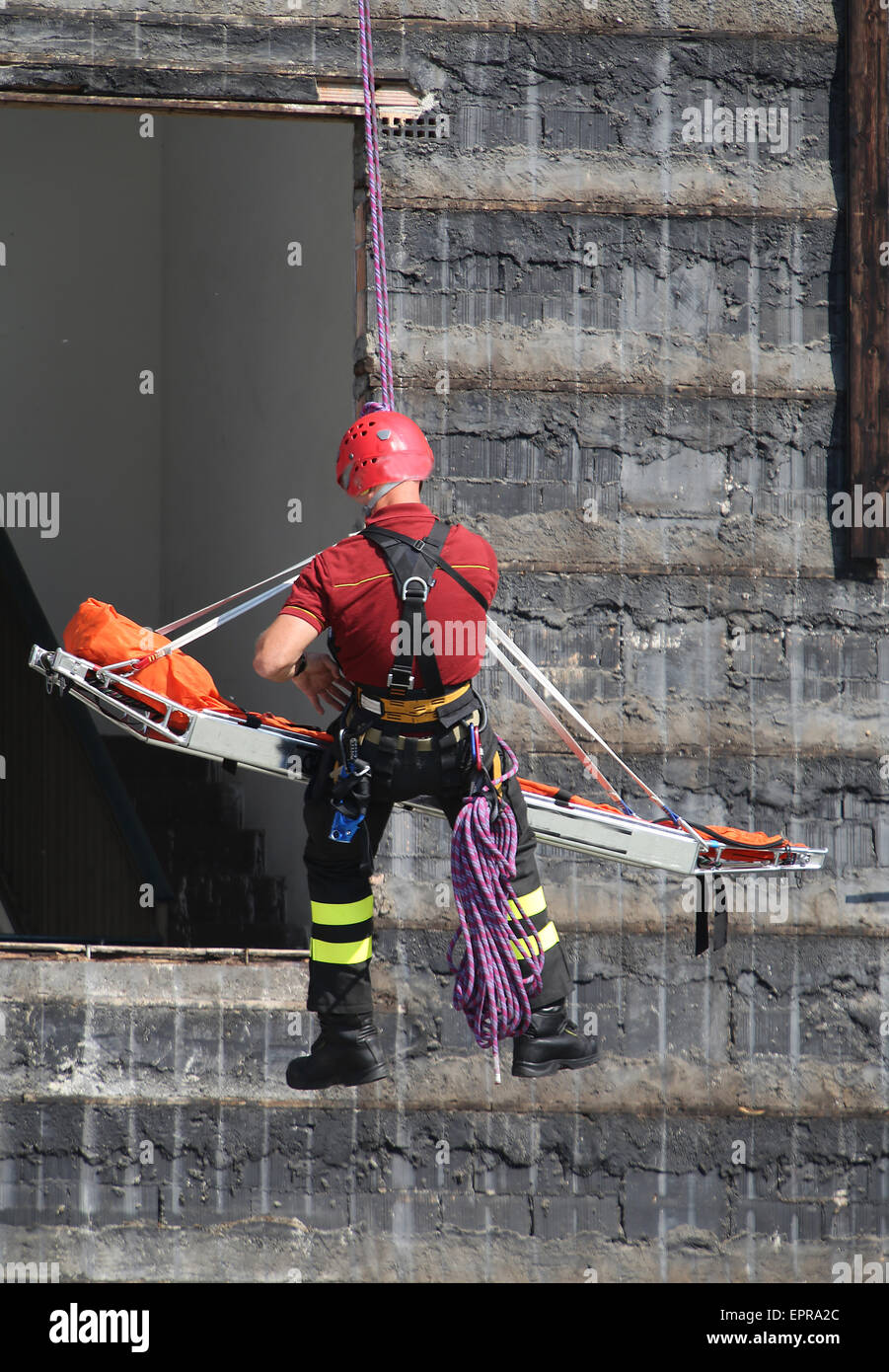 fearless fireman during an exercise carries the stretcher with the ...