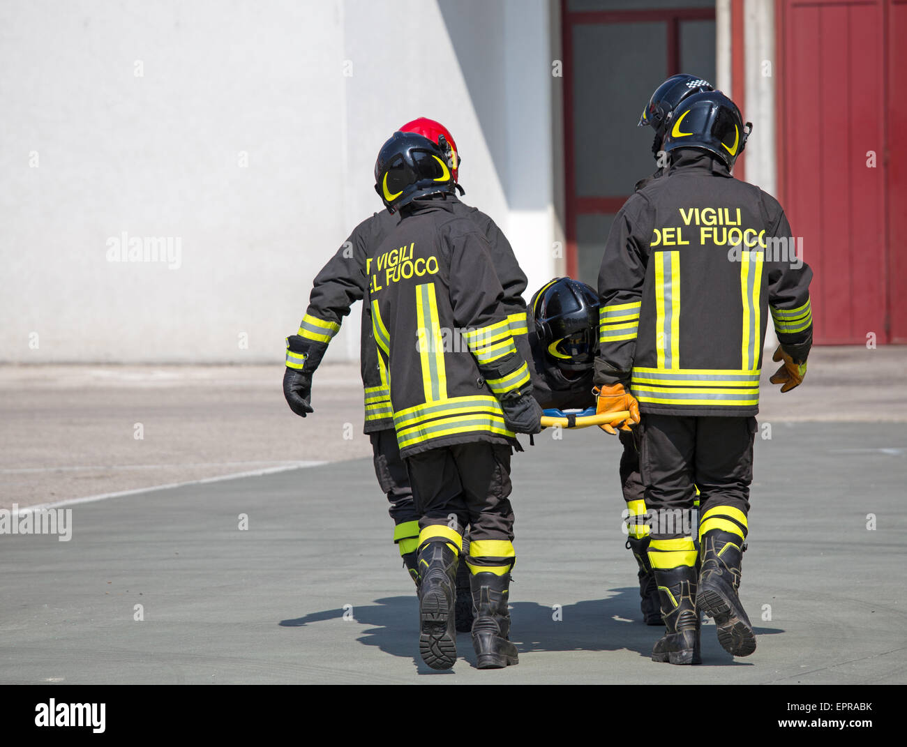 Four brave Firefighters carry a fellow firefighter with the medical ...