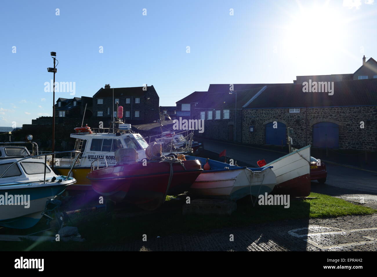 Craster a view of the boats along the harbour Stock Photo - Alamy
