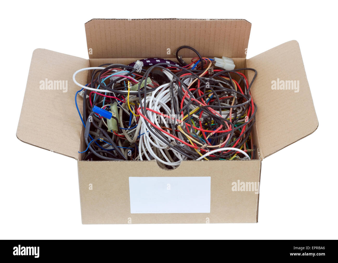 The heap of old copper wires in a cardboard box is prepared for ...