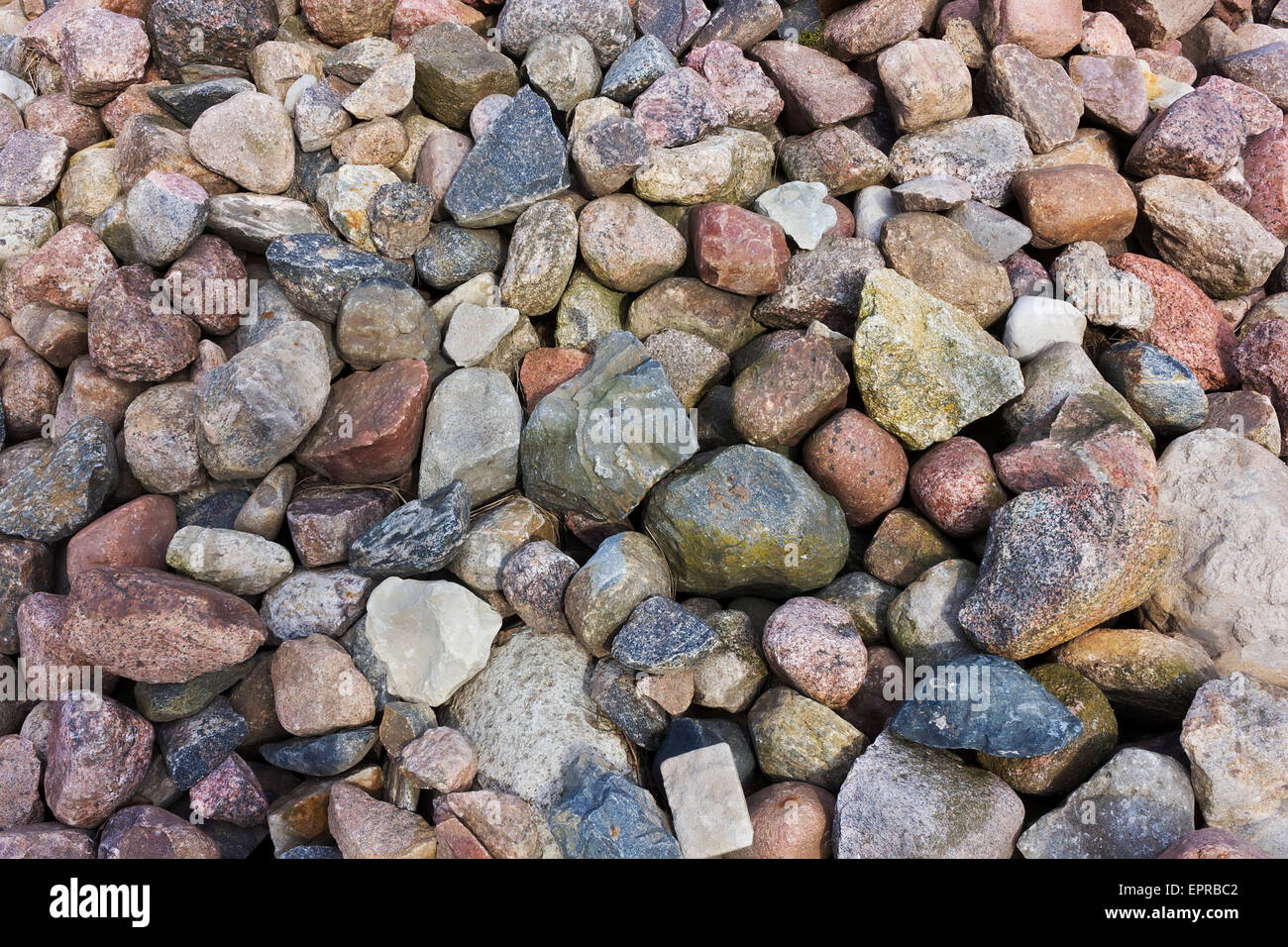 Small granite colorful cobble stones background Stock Photo - Alamy