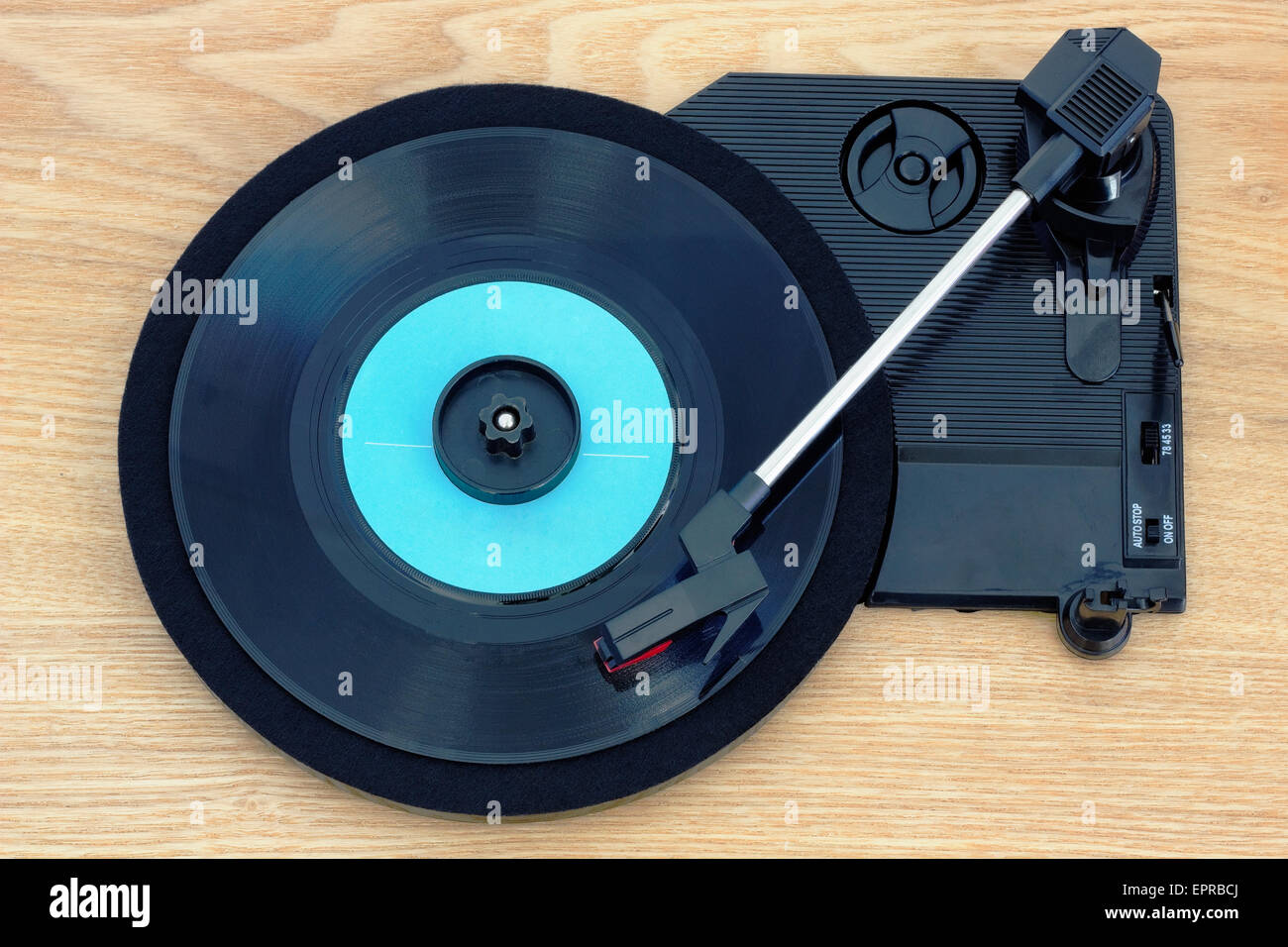 Retro music from old vinyl single on an electric record player. Mass ...