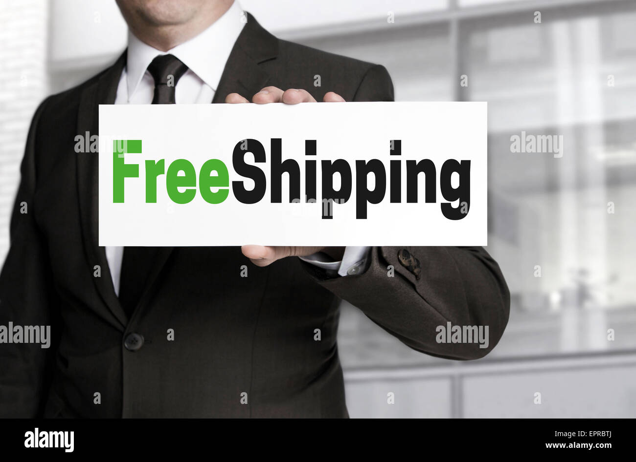 freeshipping sign is held by businessman Stock Photo - Alamy