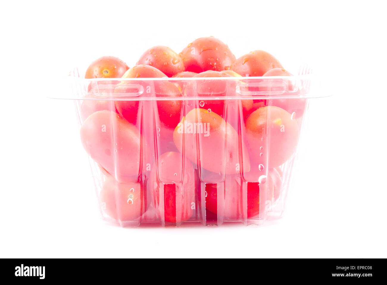 Bunch of grape tomatoes isolated in plastic basket Stock Photo - Alamy