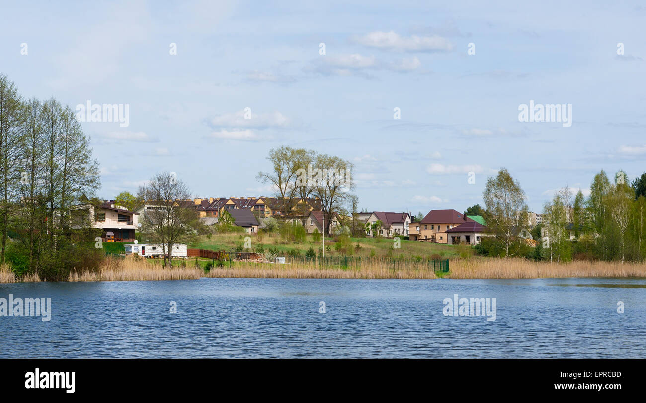Spring landscape of the small European village on the bank of the cold ...