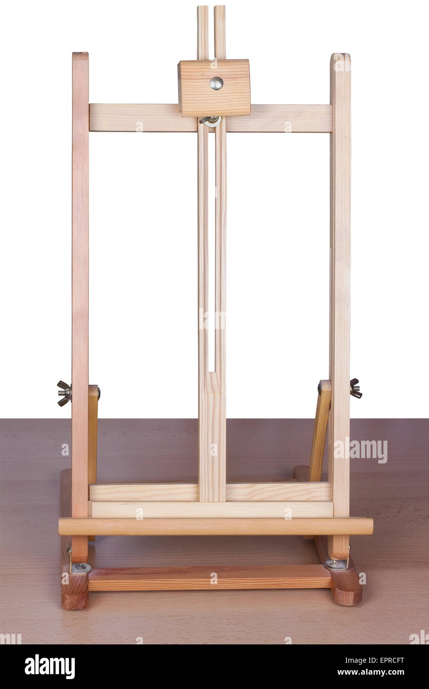 The portable wooden easel for the modern artist is on a table. Isolated ...