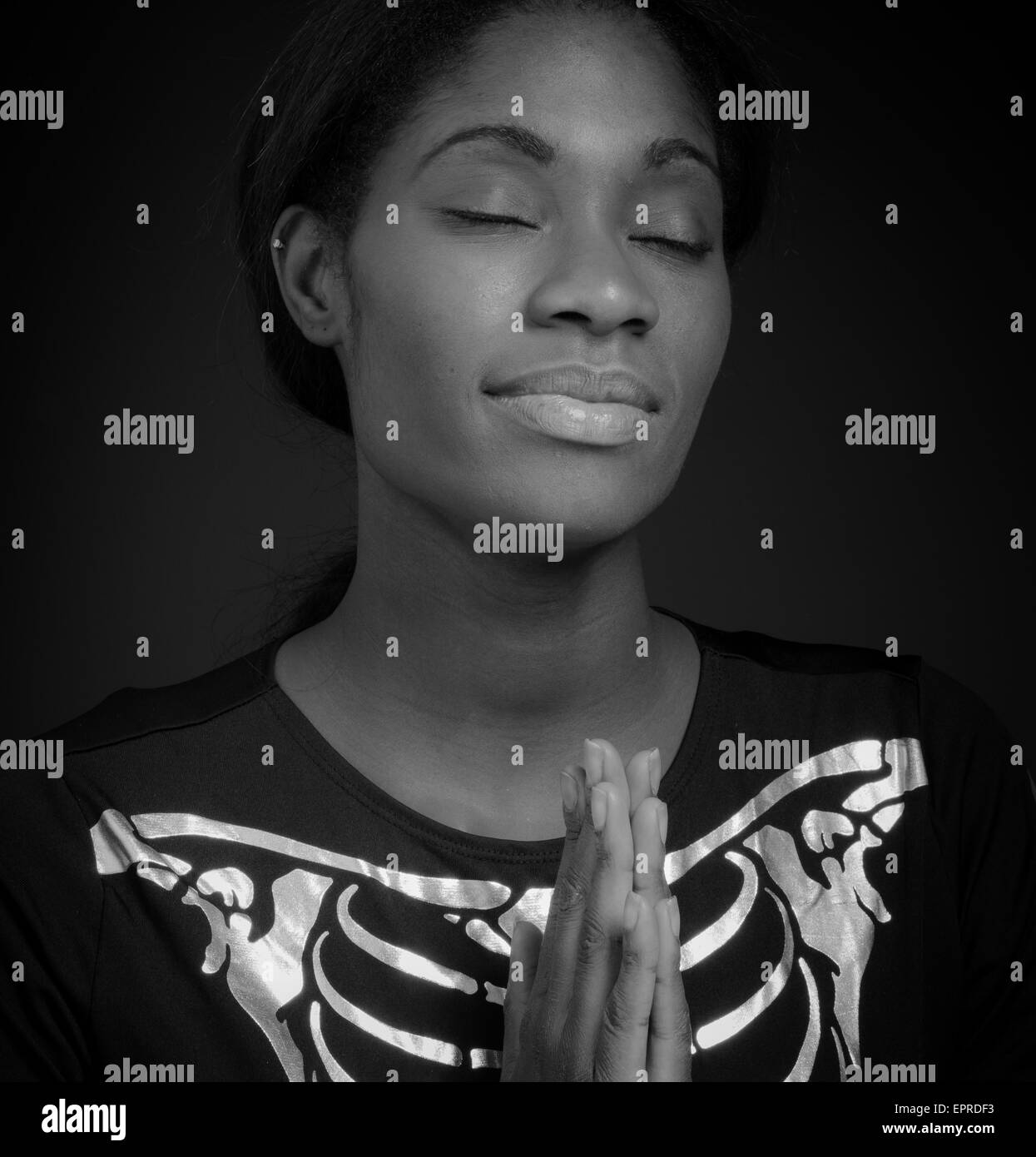 Model isolated praying Stock Photo - Alamy