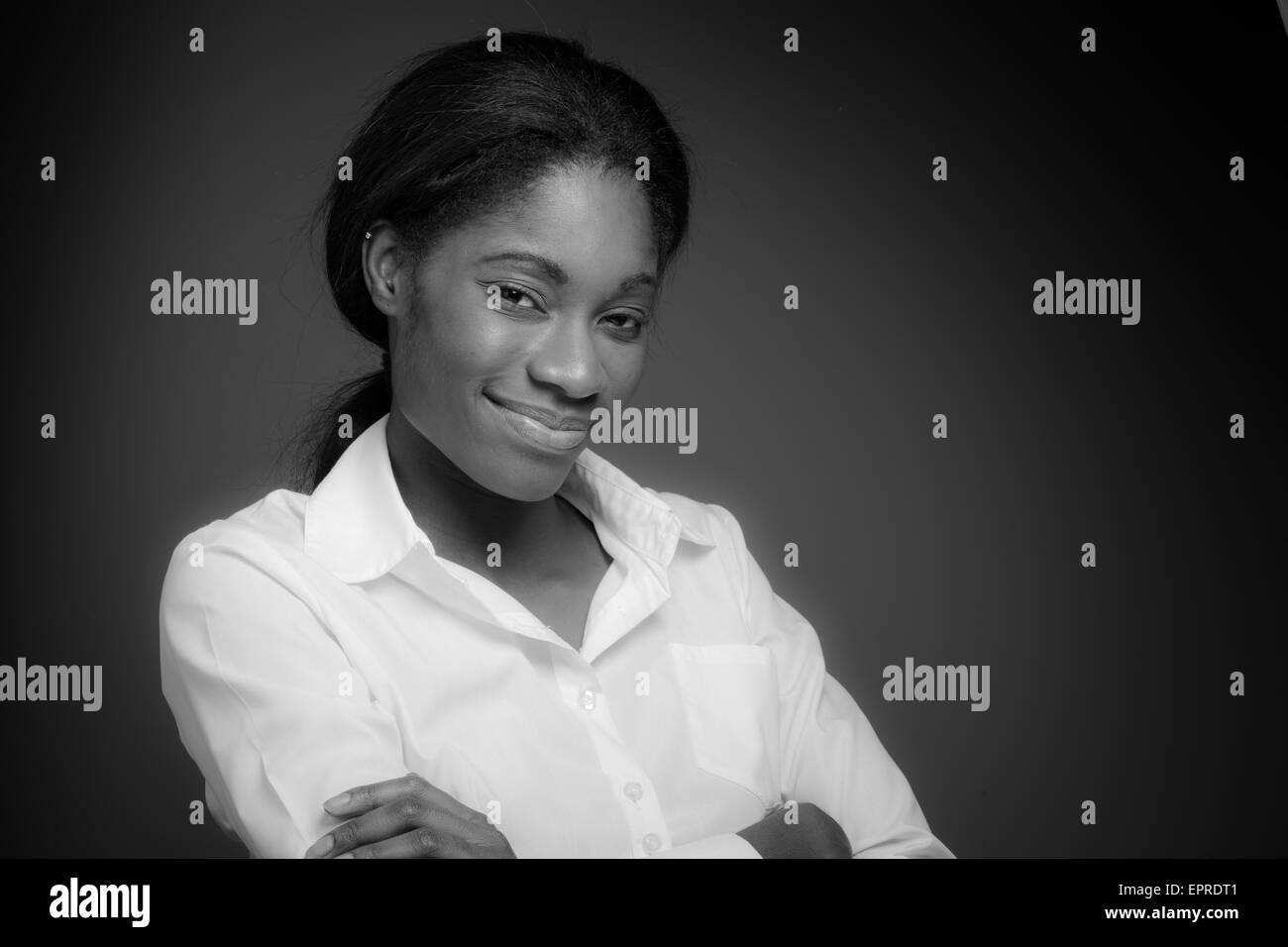 Model successful with arms crossed confident Stock Photo - Alamy