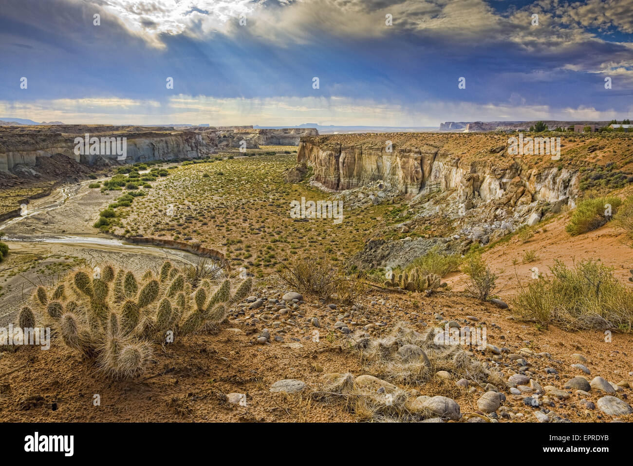 Crumbling cliffs line the edge of a desert arroyo Stock Photo - Alamy