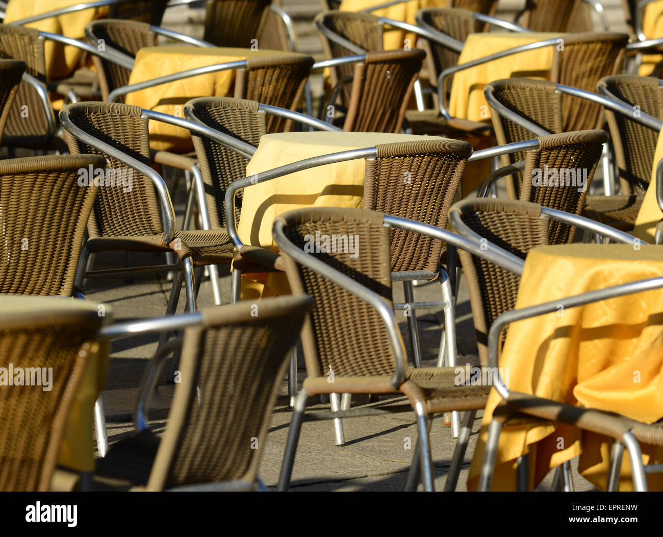 Street view of a coffee terrace with tables and chairs Stock Photo - Alamy