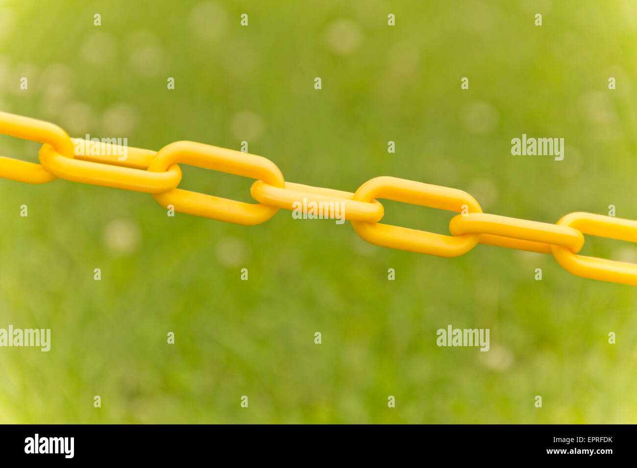A yellow chain link passes through the frame forbiding or connecting ...