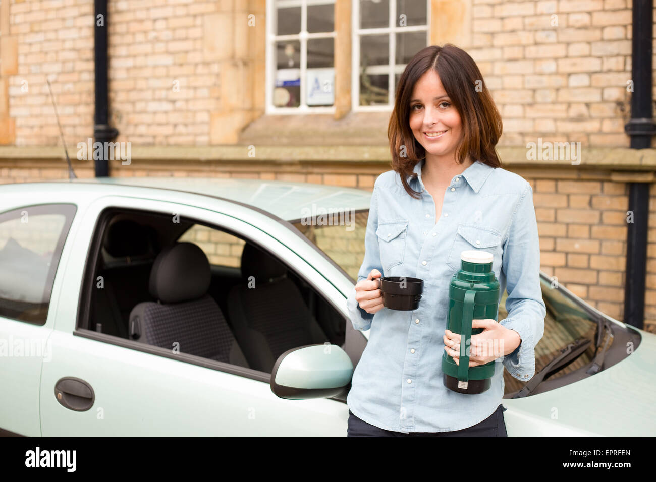 young woman stopping for a coffee during a long journey Stock Photo - Alamy