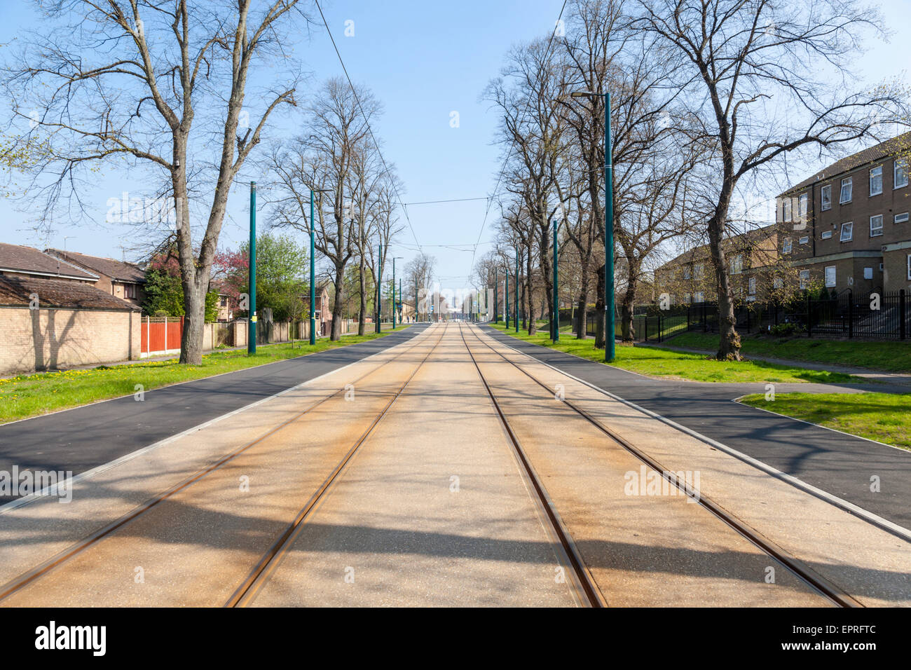 Tramline through The Meadows in Nottingham, England, UK Stock Photo - Alamy