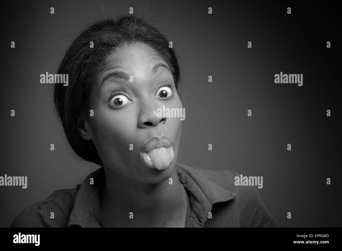 Young girl tongue out Black and White Stock Photos & Images - Alamy