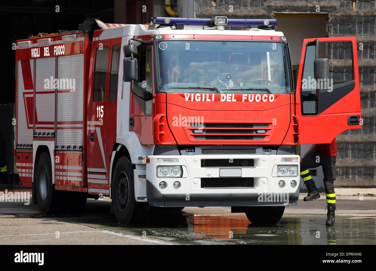 italian fire trucks with sirens blue and a fireman ready for emergency ...
