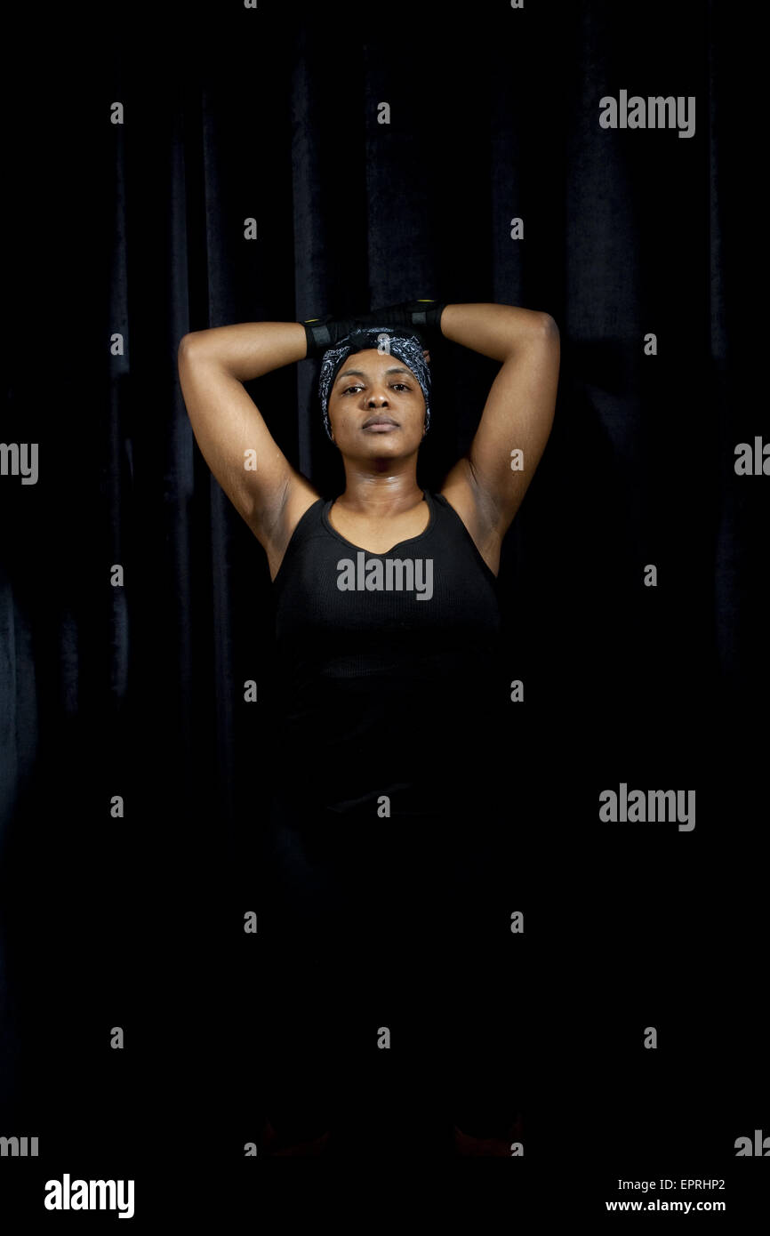A female boxer wearing a headband stands for a portrait at the Canadian ...
