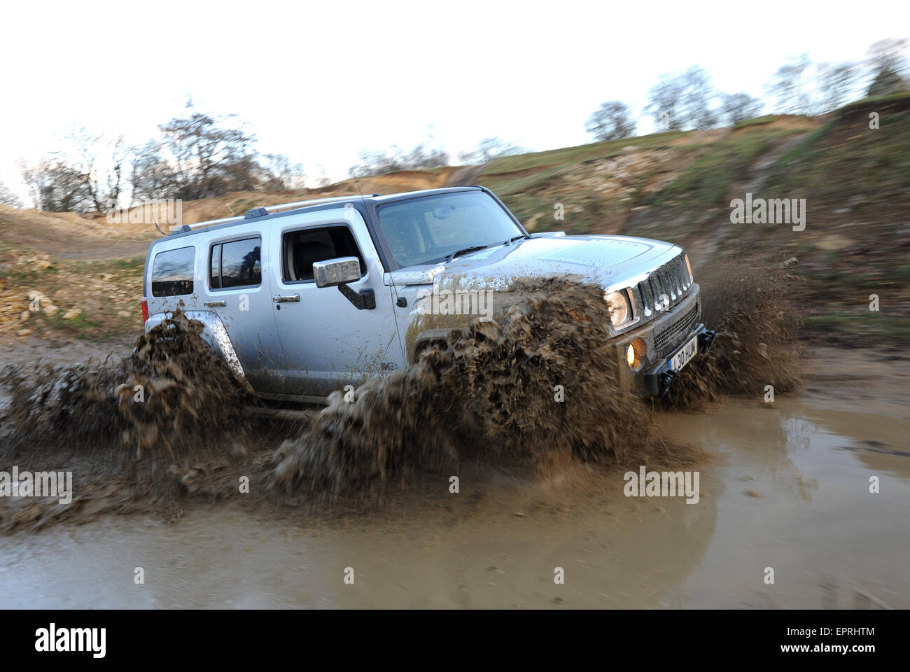 Hummer H3 driving off road through deep muddy water Stock Photo - Alamy