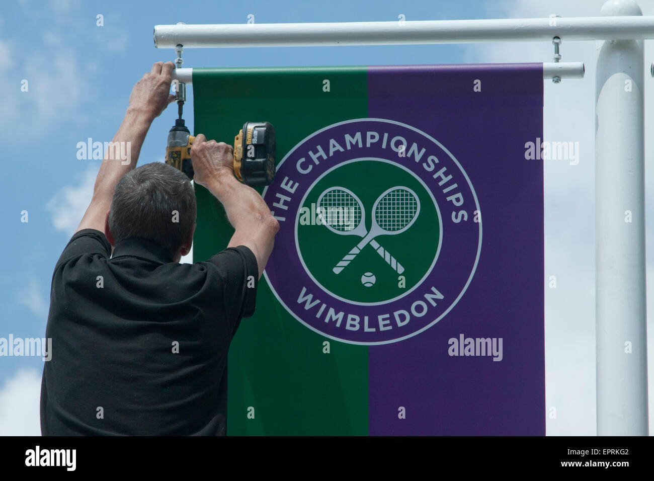 Wimbledon, London, UK. 21st May, 2015. Workers unveil the 2014 ...