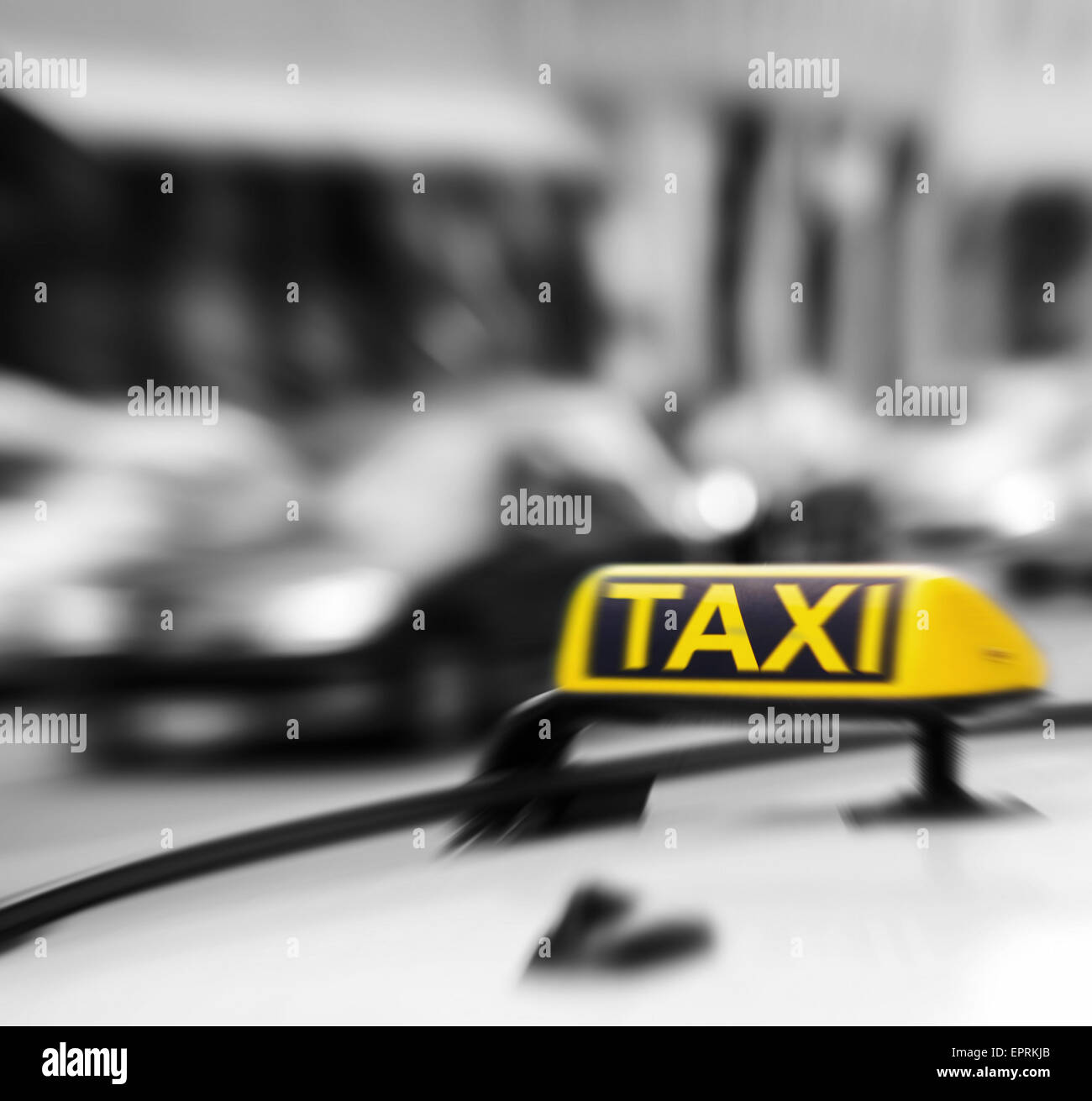Taxi sign on car in motion blur Stock Photo - Alamy