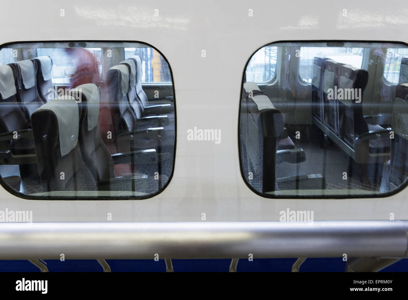 Looking inside passenger windows of the Shinkansen (bullet train) at ...