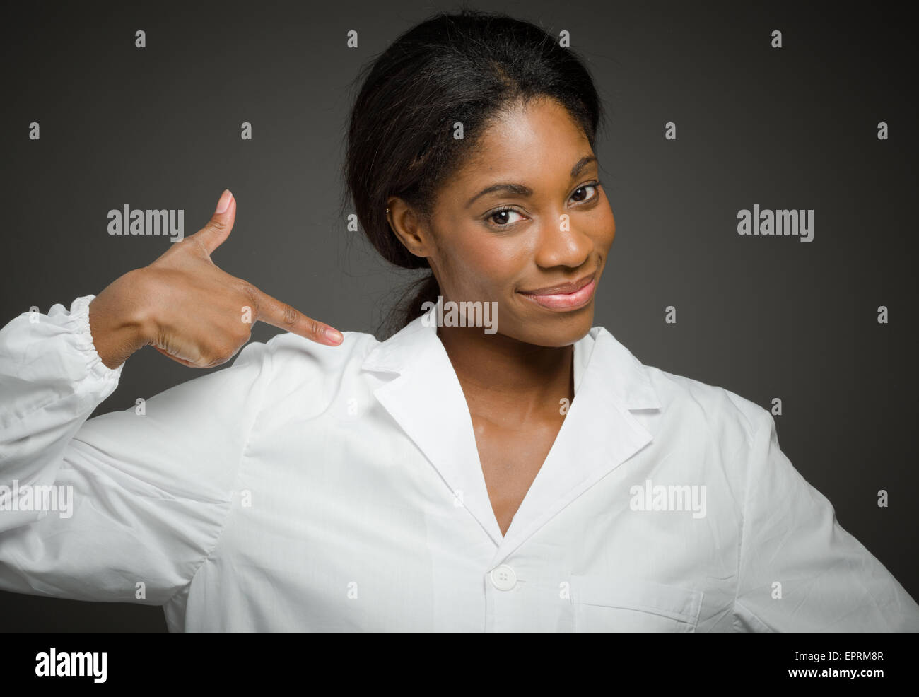 Model isolated on plain background in studio pointing Stock Photo - Alamy