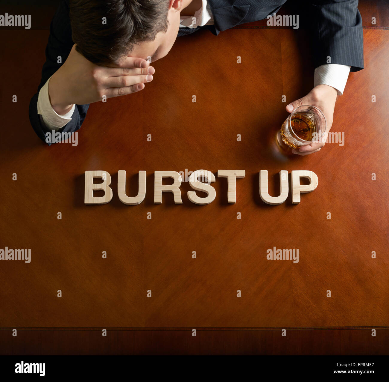 Phrase Burst Up and devastated man composition Stock Photo - Alamy