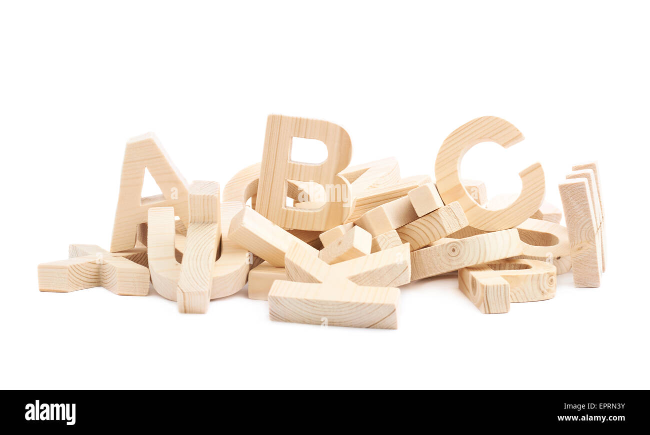 Pile of wooden block letters isolated Stock Photo - Alamy