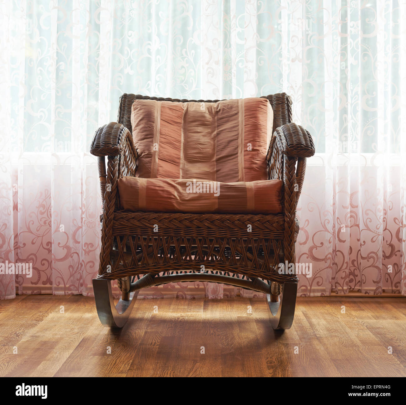 Wicker rocking chair composition Stock Photo - Alamy