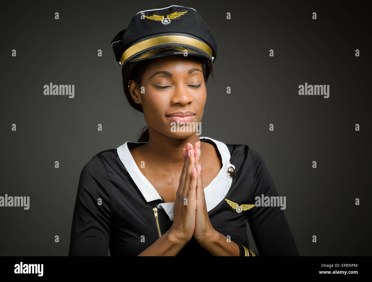 Model isolated on plain background in studio wishing praying Stock ...